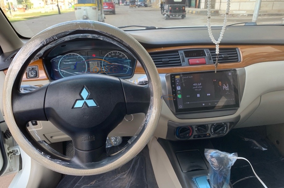 Lancer Puma Mitsubishi 2014 El Senbellawein White 6848828 - Car for ...