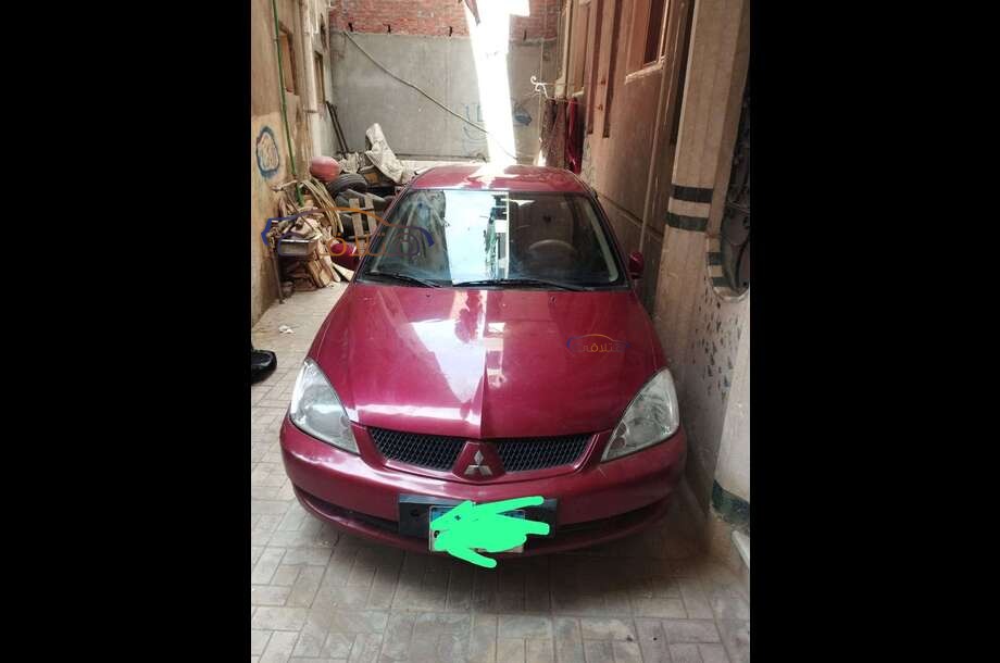 Lancer Puma Mitsubishi 2010 Qalyubia Red 6858386 - Car for sale : Hatla2ee