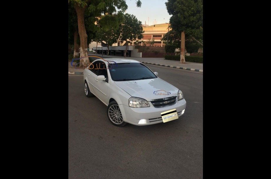 Optra Chevrolet 2014 Asyut White 6864152 - Car for sale : Hatla2ee