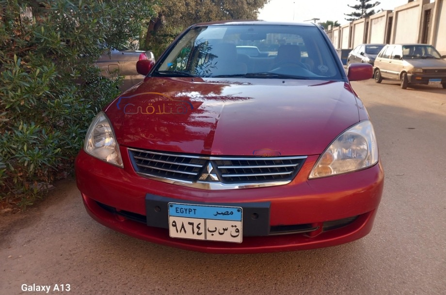 Lancer Puma Mitsubishi 2010 Damietta Red 6873825 - Car for sale : Hatla2ee