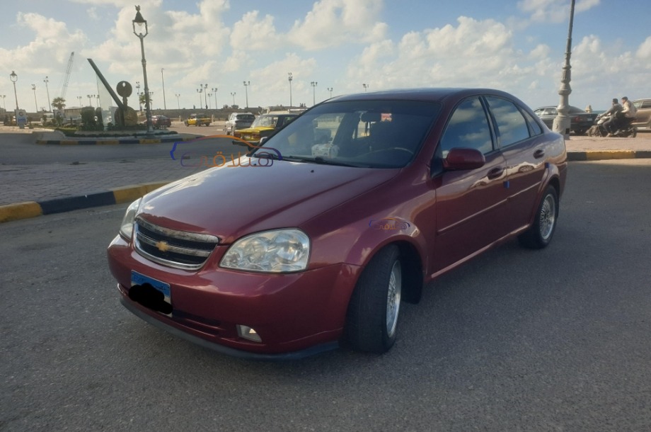 Optra Chevrolet 2013 Alexandria Red 6875643 - Car for sale : Hatla2ee