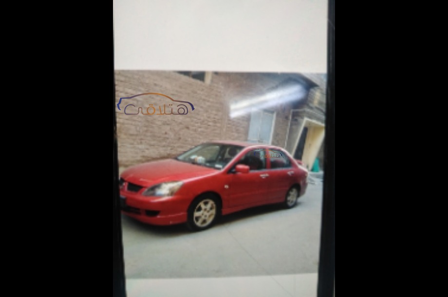 Lancer Puma Mitsubishi 2009 Luxor Red 6880391 - Car for sale : Hatla2ee