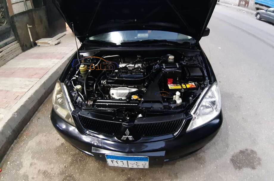 Lancer Puma Mitsubishi 2009 Sharqia Black 6881858 - Car for sale : Hatla2ee