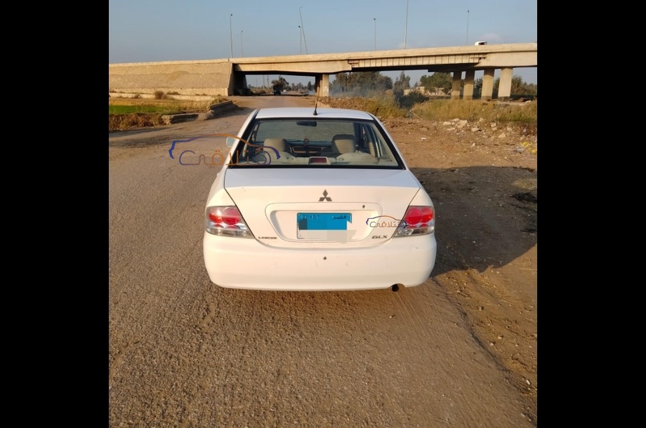 Lancer Puma Mitsubishi 2009 Tanta White 6888206 - Car for sale : Hatla2ee