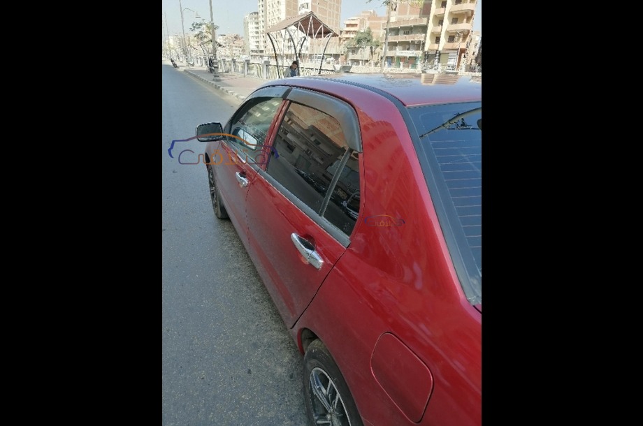 Lancer Puma Mitsubishi 2010 Tanta Red 6907937 - Car for sale : Hatla2ee