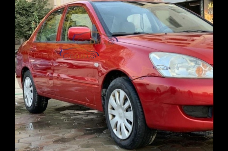 Lancer Puma Mitsubishi 2006 Beni Suef Red 6910886 - Car for sale : Hatla2ee