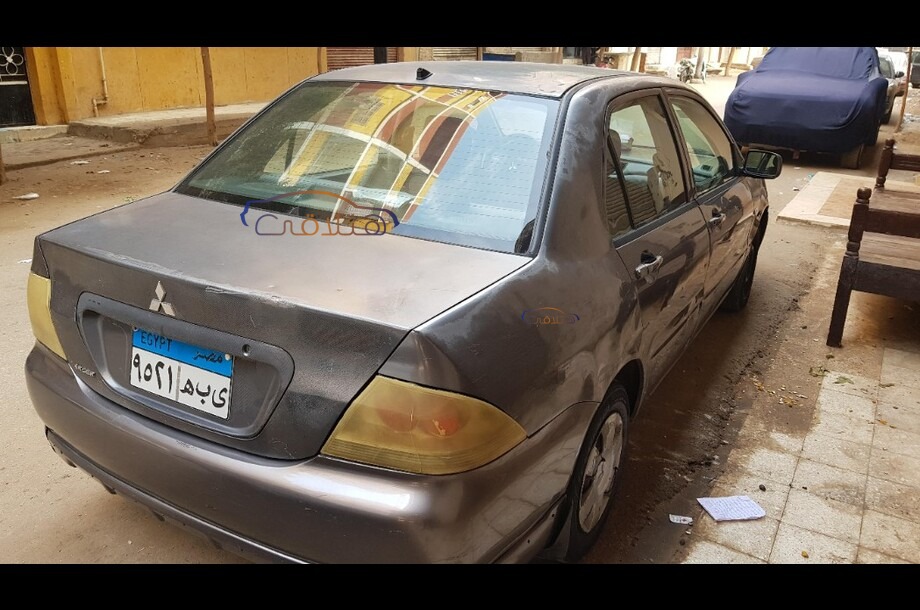 Lancer Puma Mitsubishi 2009 Asyut Silver 6917105 - Car for sale : Hatla2ee
