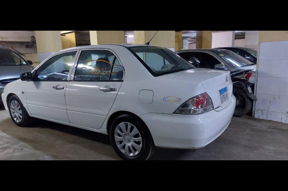 Lancer Puma Mitsubishi 2010 Shobra White 6917426 - Car for sale : Hatla2ee