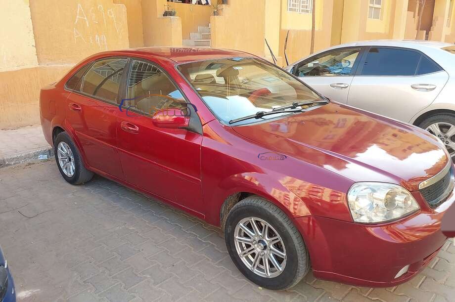 Optra Chevrolet 2010 6 October Dark red 6917920 - Car for sale : Hatla2ee
