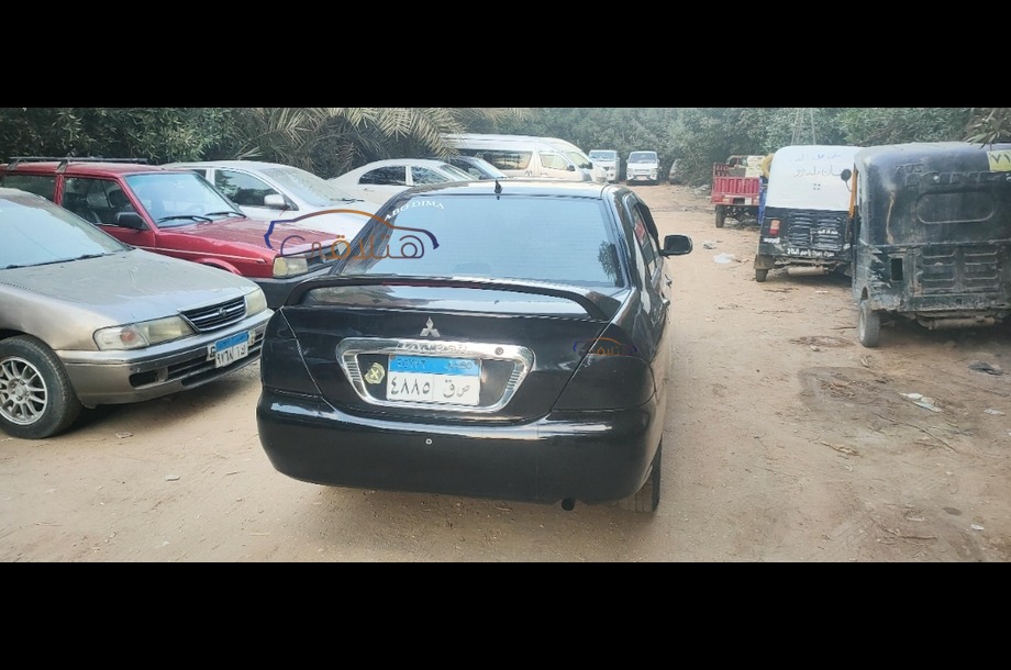 Lancer Puma Mitsubishi 2009 Kerdasa Black 6930788 - Car for sale : Hatla2ee