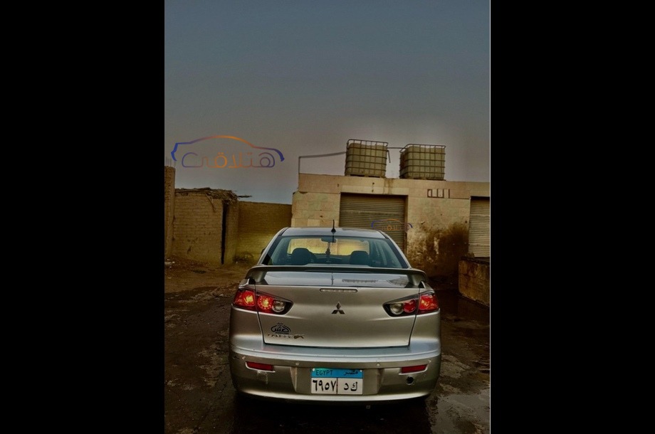 Lancer Mitsubishi 2014 6 October Silver 6931317 - Car for sale : Hatla2ee