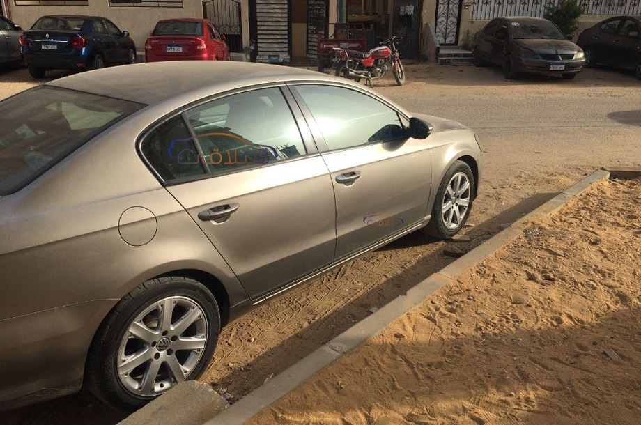 Passat Volkswagen 2015 6 October Gold 6936463 - Car for sale : Hatla2ee