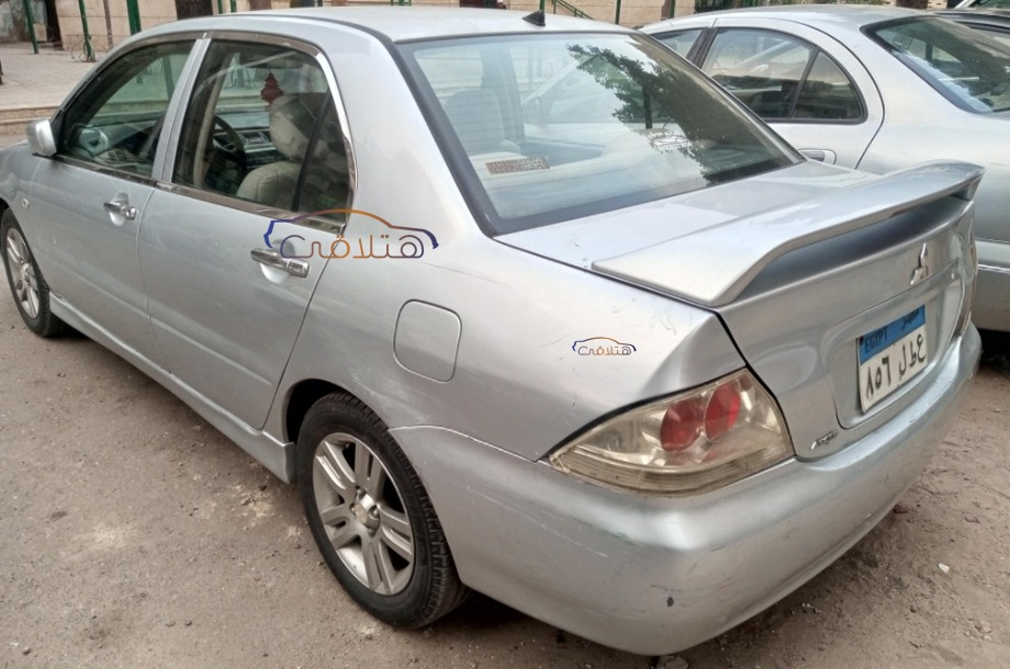 Lancer Puma Mitsubishi 2011 Cairo Silver 6944933 - Car for sale : Hatla2ee