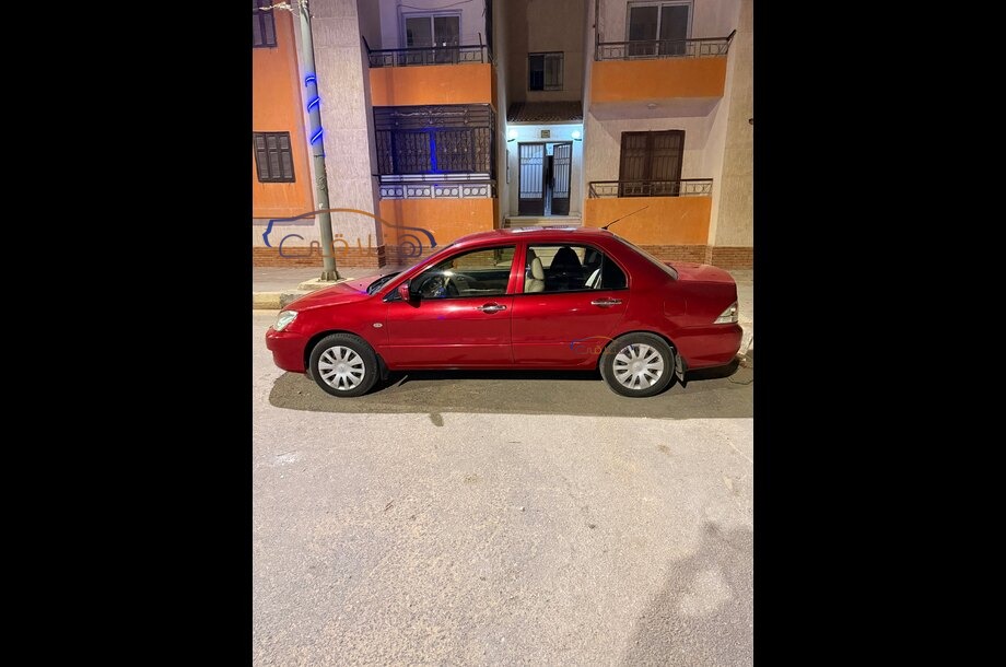Lancer Puma Mitsubishi 2014 6 October Red 6950565 - Car for sale : Hatla2ee