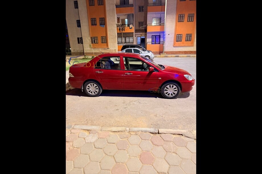 Lancer Puma Mitsubishi 2014 6 October Red 6950565 - Car for sale : Hatla2ee