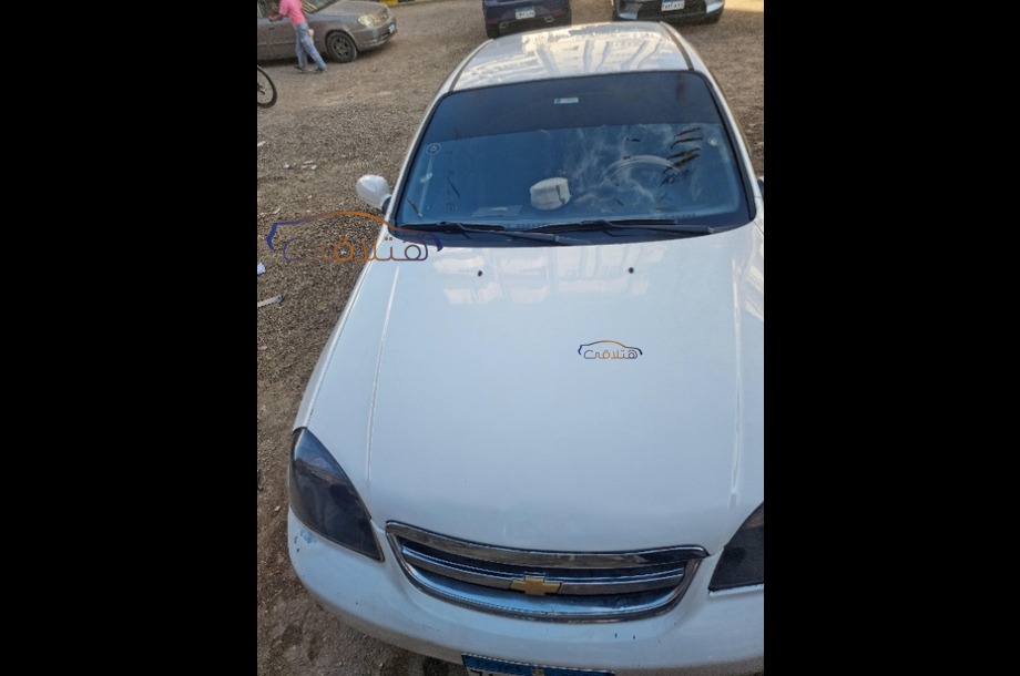 Optra Chevrolet 2014 Suez White 6953850 - Car for sale : Hatla2ee