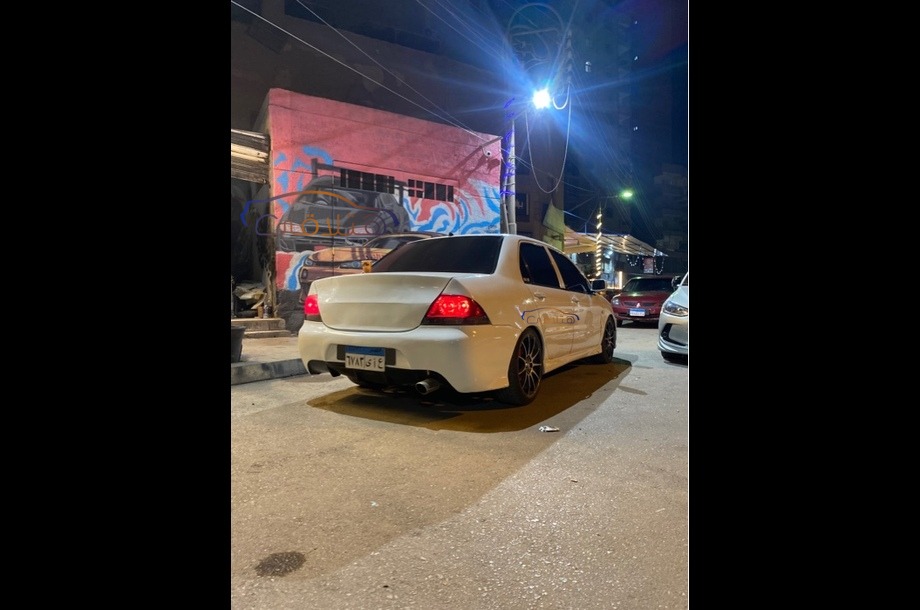 Lancer Puma Mitsubishi 2012 Gharbia White 6955627 - Car for sale : Hatla2ee