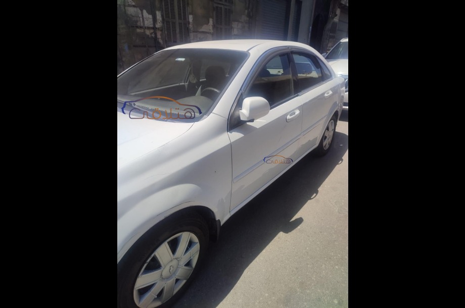 Optra Chevrolet 2014 Alexandria White 6960133 - Car for sale : Hatla2ee