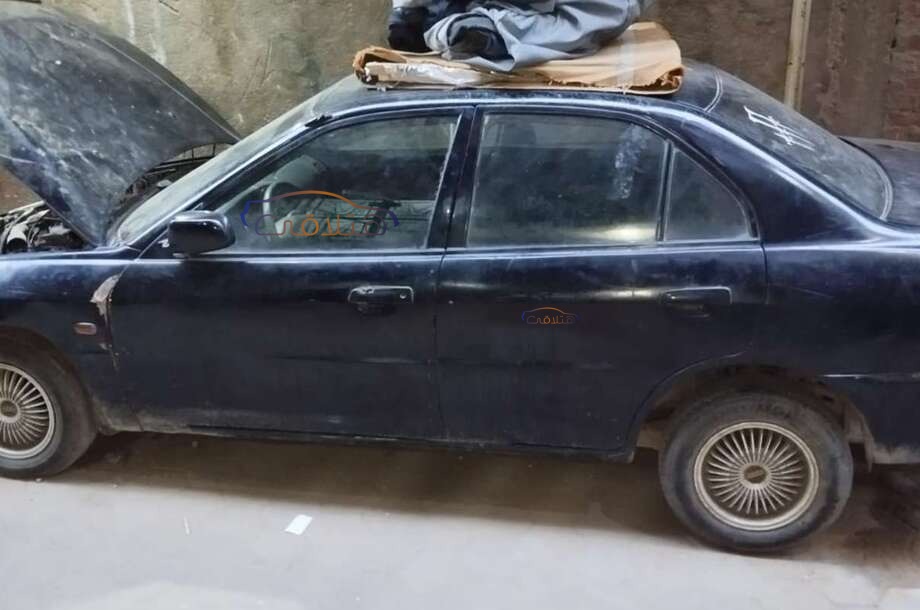 Lancer Mitsubishi 1999 Mokattam Black 6961189 - Car for sale : Hatla2ee