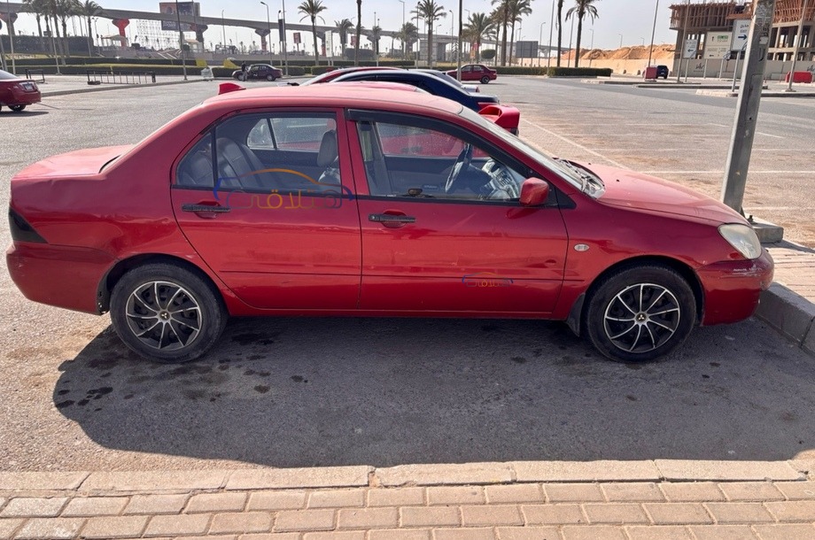 Lancer Puma Mitsubishi 2013 6 October Red 6965241 - Car for sale : Hatla2ee
