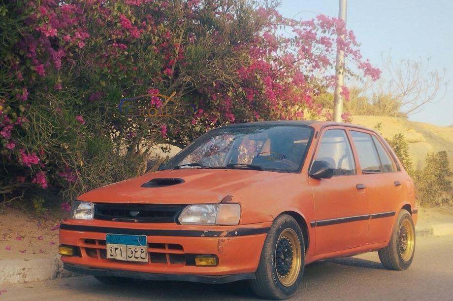 Starlet Toyota 1991 Helwan Orange 6978184 - Car for sale : Hatla2ee