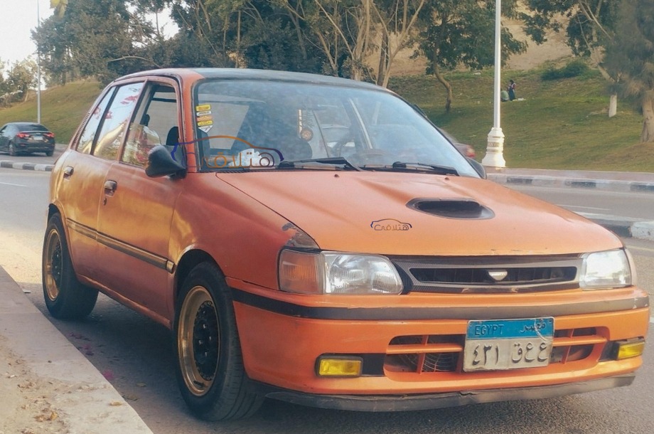 Starlet Toyota 1991 Helwan Orange 6978184 - Car for sale : Hatla2ee