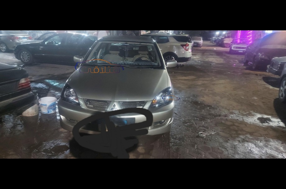 Lancer Puma Mitsubishi 2009 Shobra Gold 6983818 - Car for sale : Hatla2ee