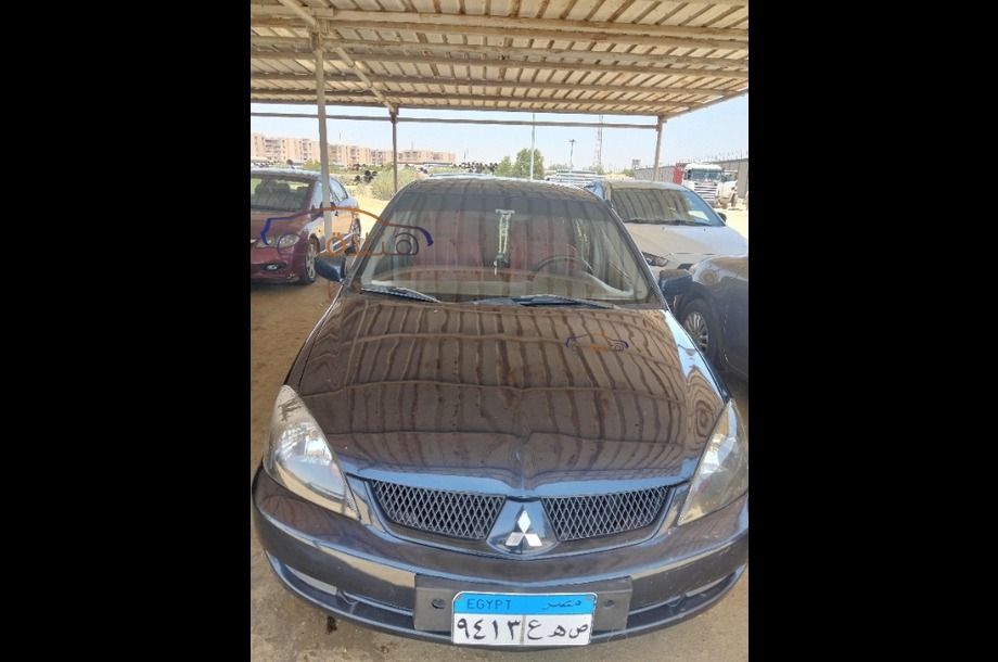 Lancer Puma Mitsubishi 2004 Suez Blue 6992461 - Car for sale : Hatla2ee