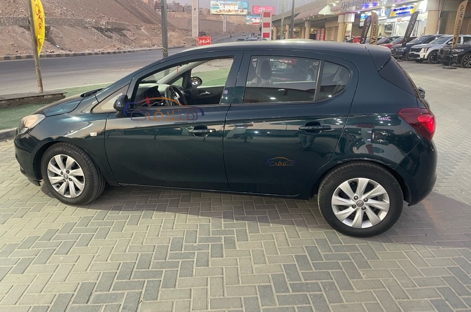Corsa E Opel 2016 Maadi Dark green 6997183 - Car for sale : Hatla2ee