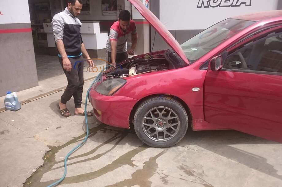 Lancer Puma Mitsubishi 2009 Beni Suef Red 6997812 - Car for sale : Hatla2ee