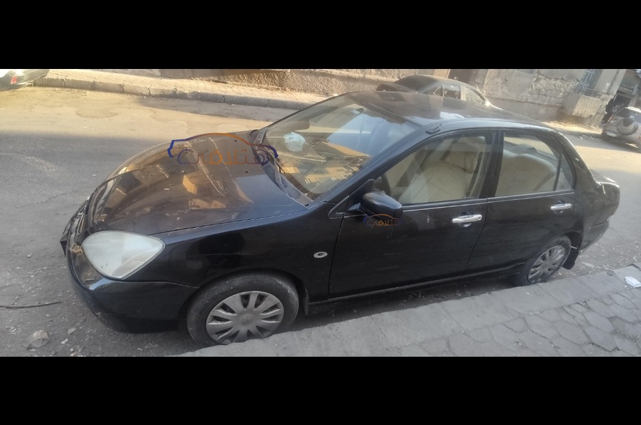 Lancer Puma Mitsubishi 2010 Shobra Black 6997880 - Car for sale : Hatla2ee