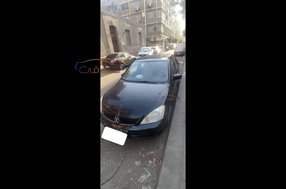 Lancer Puma Mitsubishi 2010 Shobra Black 6997880 - Car for sale : Hatla2ee