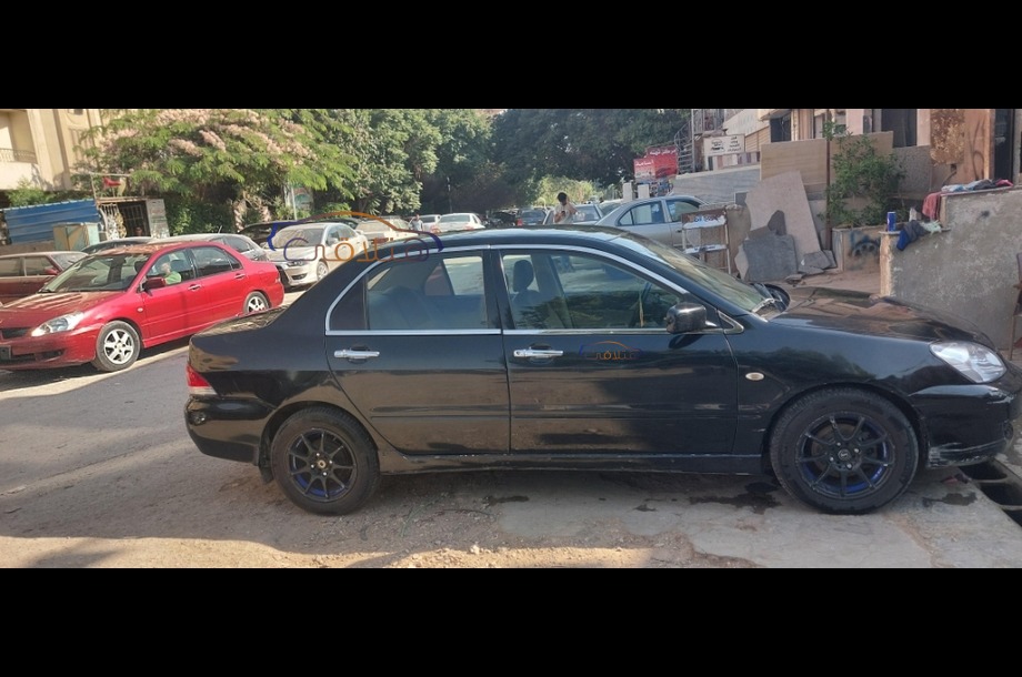 Lancer Mitsubishi 2009 Maadi Black 7012136 - Car for sale : Hatla2ee