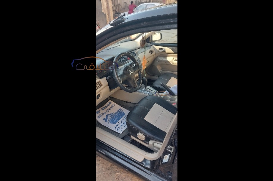 Lancer Mitsubishi 2009 Maadi Black 7012136 - Car for sale : Hatla2ee