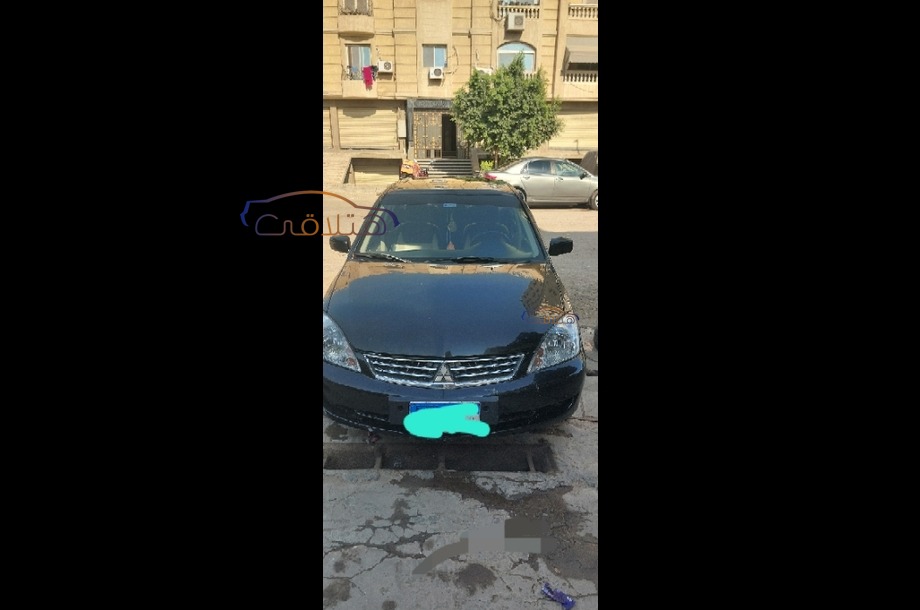 Lancer Mitsubishi 2009 Maadi Black 7012136 - Car for sale : Hatla2ee