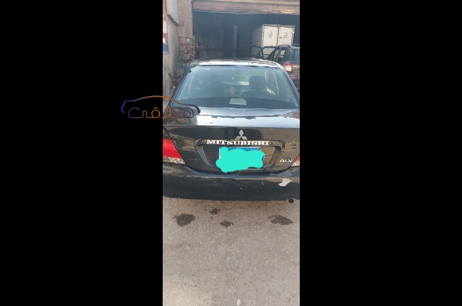 Lancer Mitsubishi 2009 Maadi Black 7012136 - Car for sale : Hatla2ee