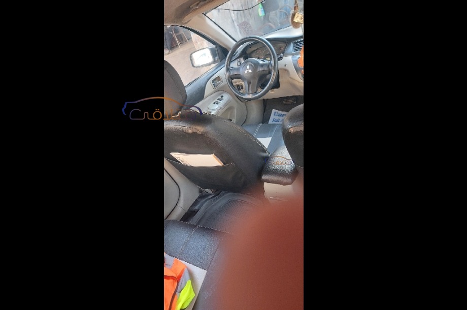Lancer Mitsubishi 2009 Maadi Black 7012136 - Car for sale : Hatla2ee