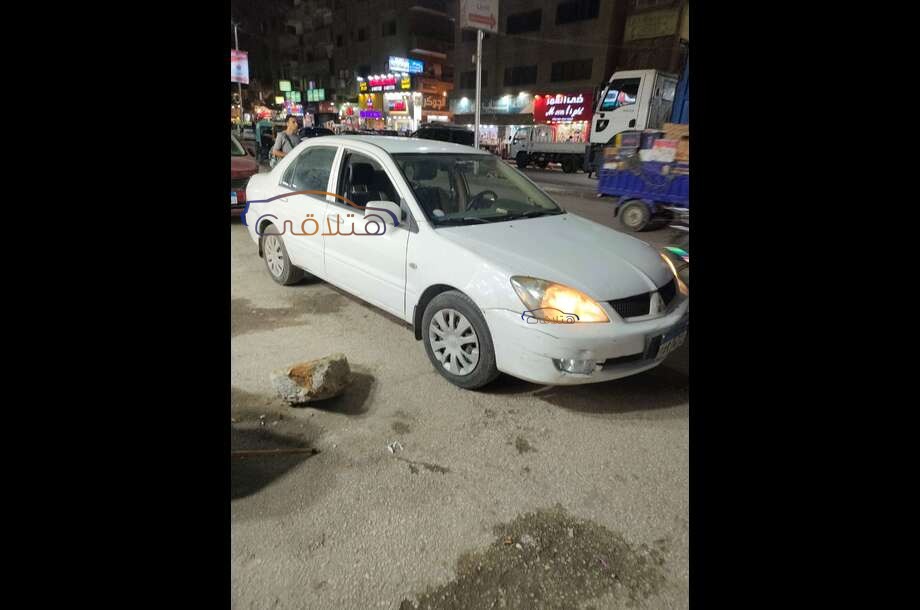 Lancer Puma Mitsubishi 2011 Maadi White 7013139 - Car for sale : Hatla2ee