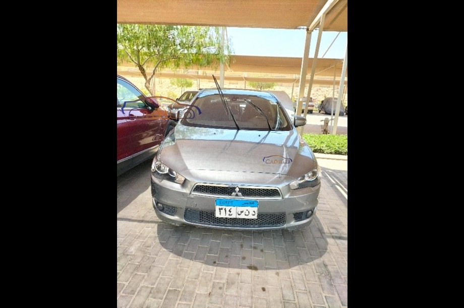 Lancer Puma Mitsubishi 2016 Cairo Silver 7014819 - Car for sale : Hatla2ee
