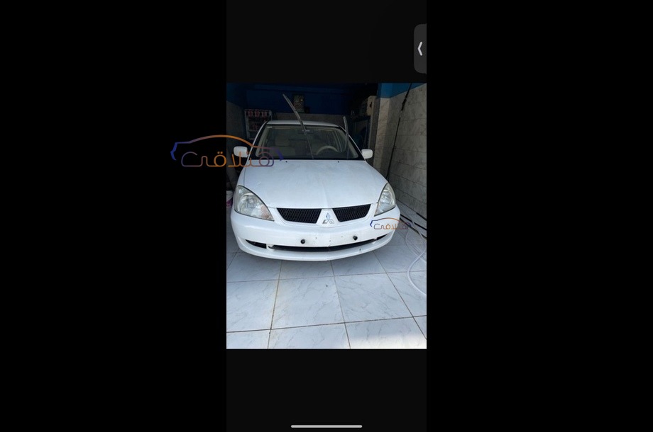 Lancer Puma Mitsubishi 2009 Suez White 7016813 - Car for sale : Hatla2ee