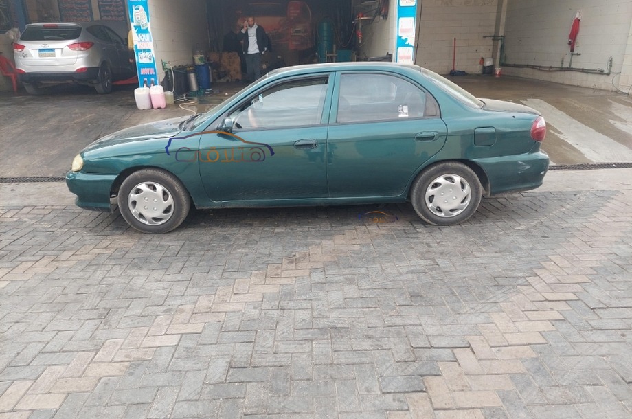 Sephia Kia 1999 6 October Dark green 7022859 - Car for sale : Hatla2ee