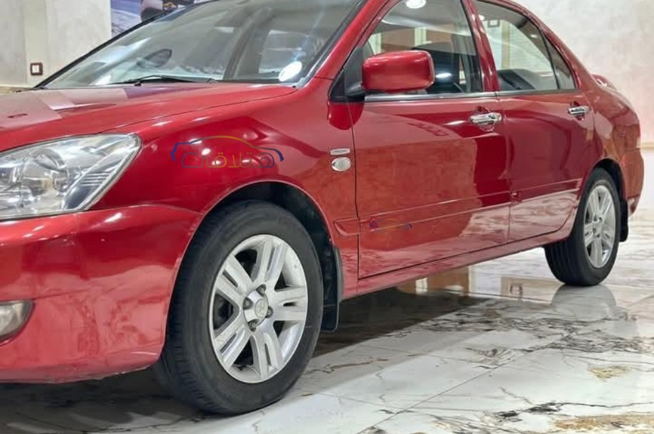 Lancer Mitsubishi 2013 Faiyum Red 7050658 - Car for sale : Hatla2ee