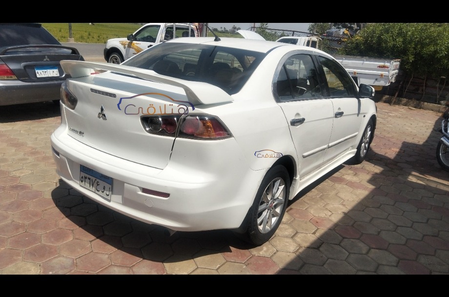 Lancer Mitsubishi 2015 Gharbia White 7061118 - Car for sale : Hatla2ee