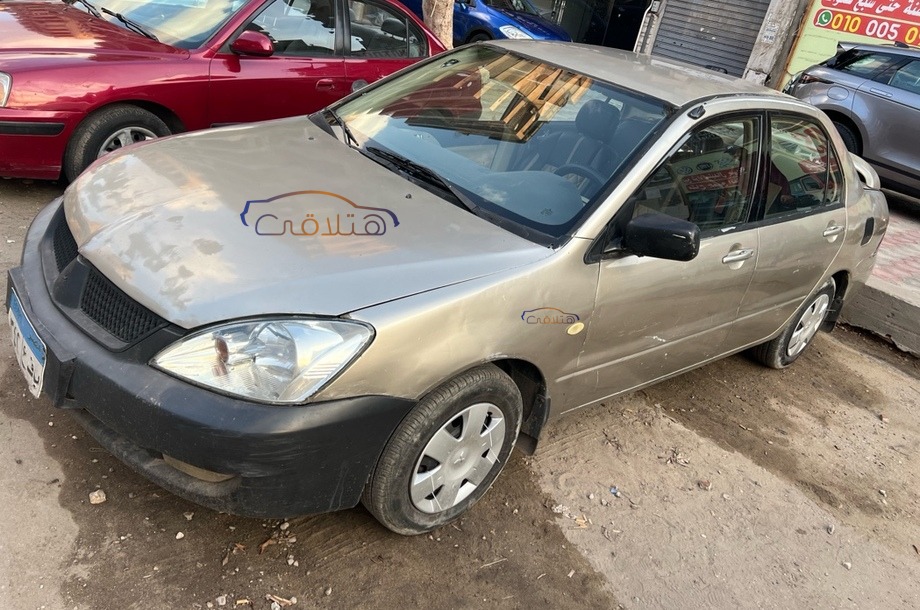 Lancer Puma Mitsubishi 2004 Cairo Silver 7096457 - Car for sale : Hatla2ee